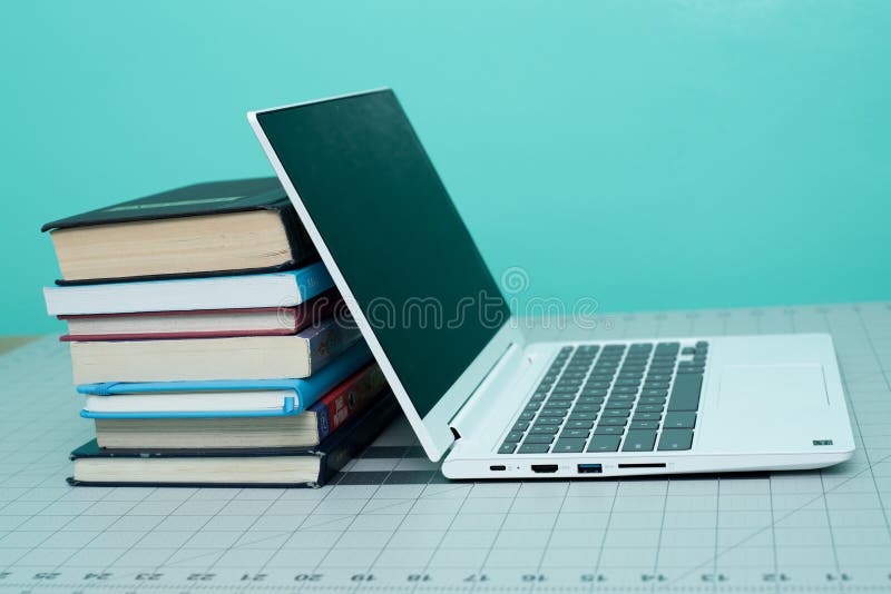 Computer with Books on a Table Station Stock Image - Image of books ...