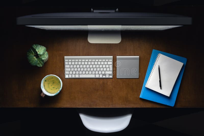 Computer, Notepads and a Cup of Tea on the Desktop at Night, Top View ...
