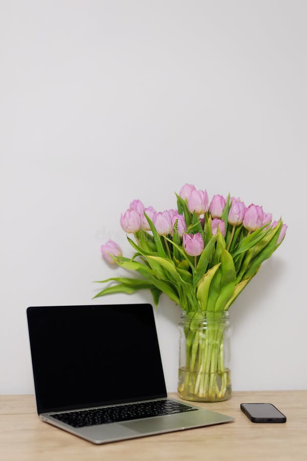 Computer, Phone and Flowers on the Table Stock Photo - Image of floral ...