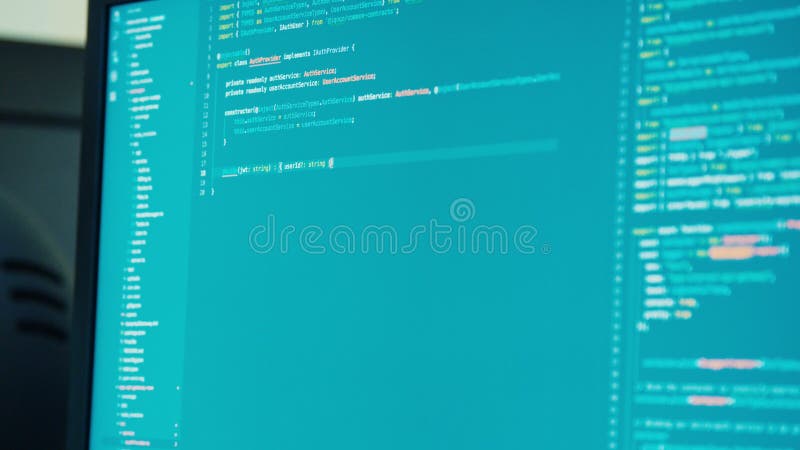 Computer Programmer Sitting in Front of a Screen Coding Software Stock ...