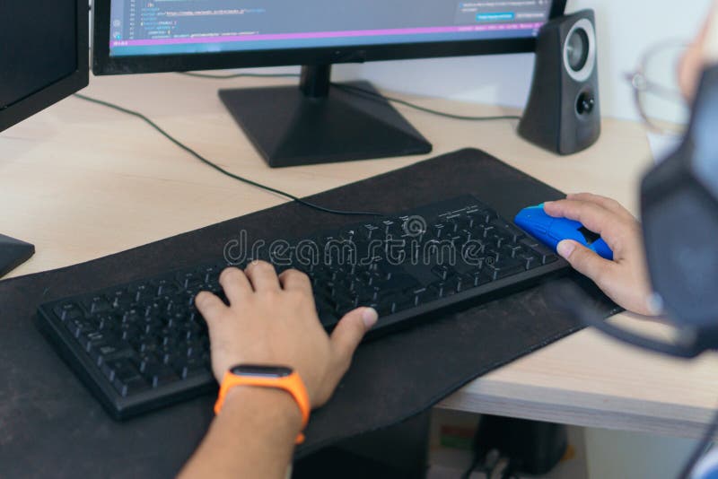 Computer Programmer Working on Computer at Workplace Stock Image ...