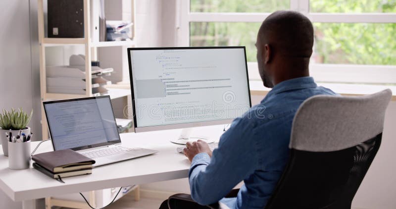Computer Programmer Writing Program Code on Computer Stock Image ...
