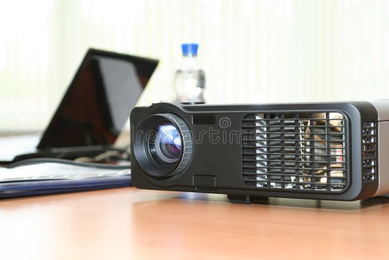 Laptop With The Projector On Office Table Stock Image - Image of ...