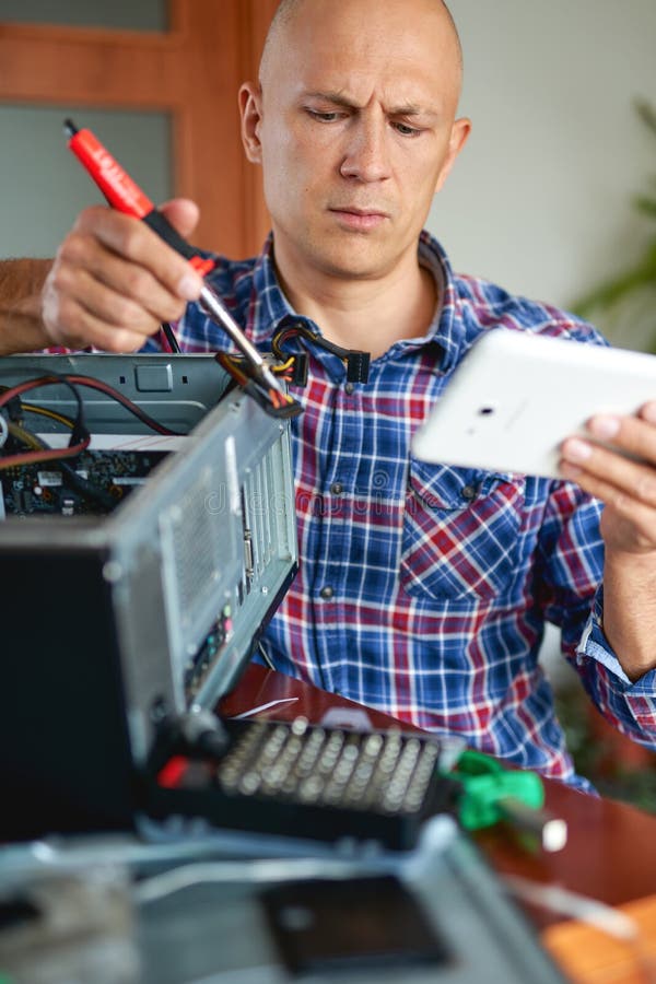 Man repairing computer stock image. Image of male, motherboard - 179535119