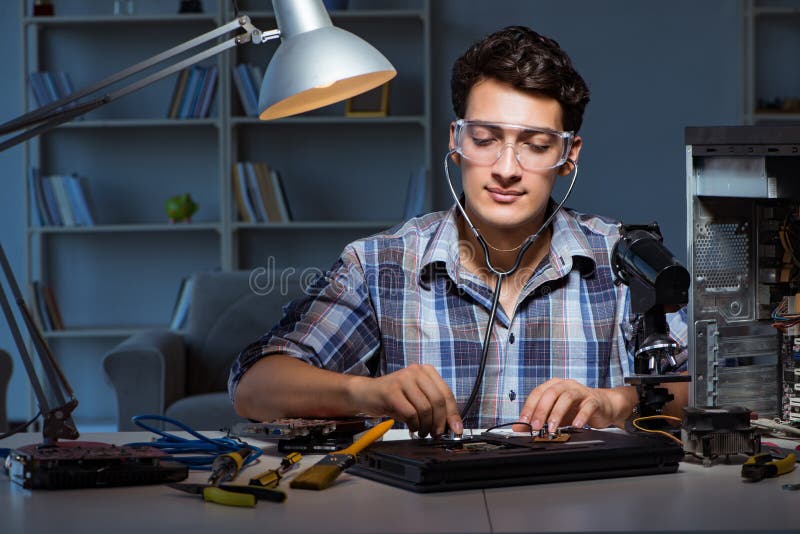 The Computer Repair Concept with Man Inspecting with Stethoscope Stock ...