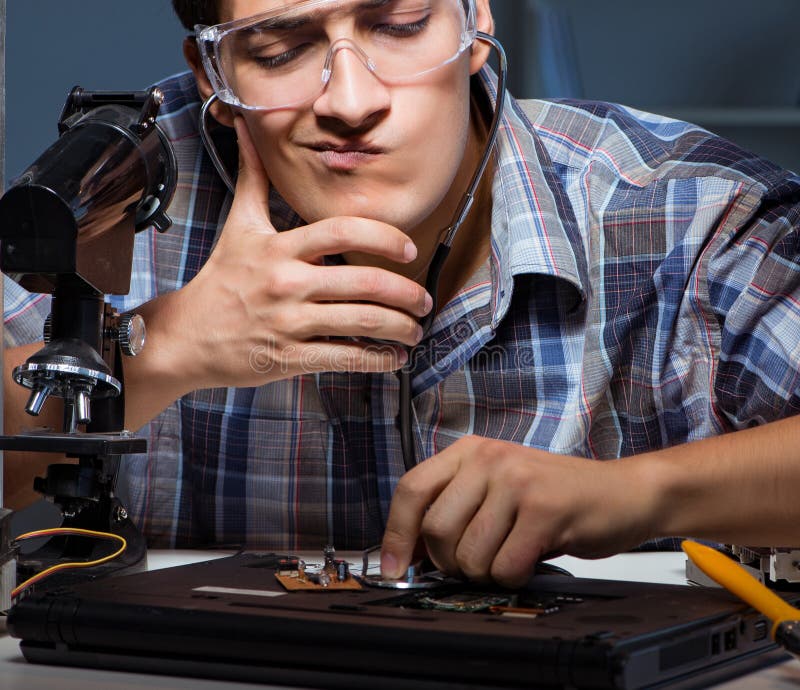 Computer Repair Concept with Man Inspecting with Stethoscope Stock ...