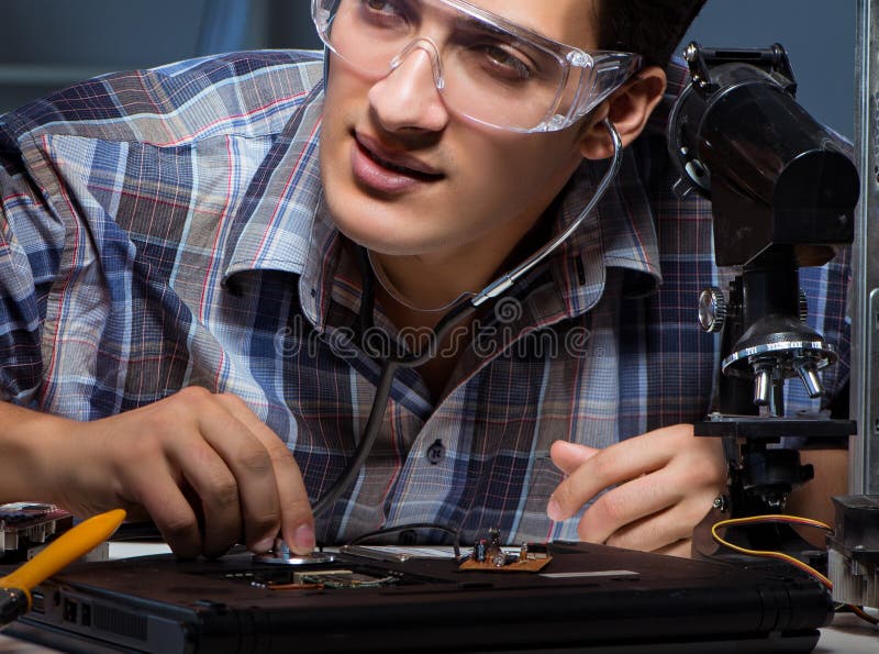 Computer Repair Concept with Man Inspecting with Stethoscope Stock ...