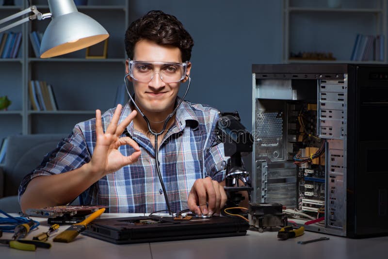 The Computer Repair Concept with Man Inspecting with Stethoscope Stock ...