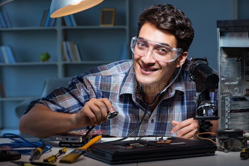 The Computer Repair Concept with Man Inspecting with Stethoscope Stock ...