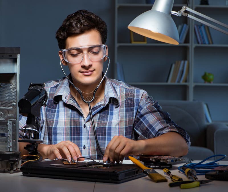 Computer Repair Concept with Man Inspecting with Stethoscope Stock ...