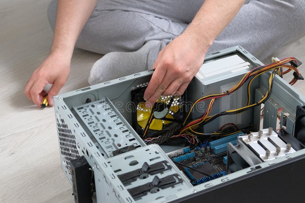 Computer Repair. Hands of Technician Repairing a Computer, Close Up ...