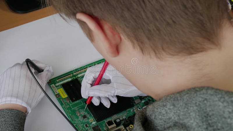 Computer Repair Service, Hands of Man Tech Testing Motherboard with ...