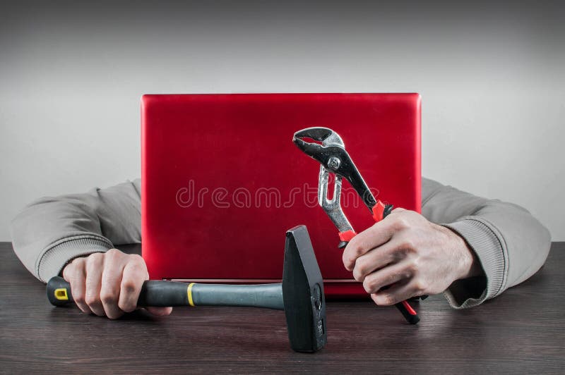 A Broken Laptop With A Hammer And Pliers Stock Image - Image of gray ...