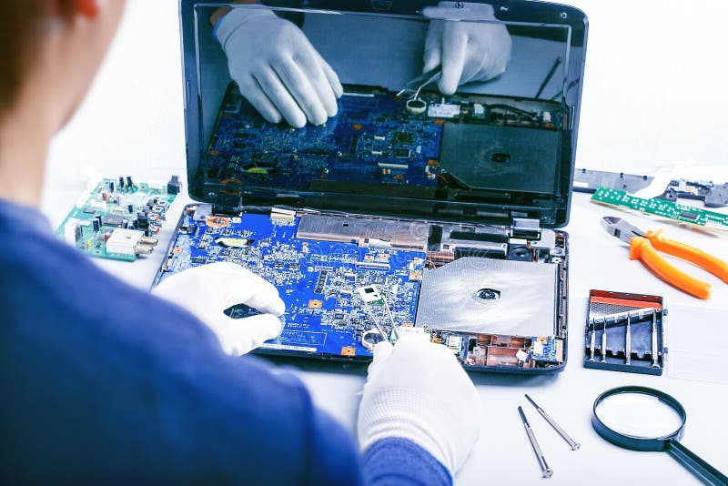 Tech Fixes Motherboard in Service Center. Repair Laptop. Stock Image ...