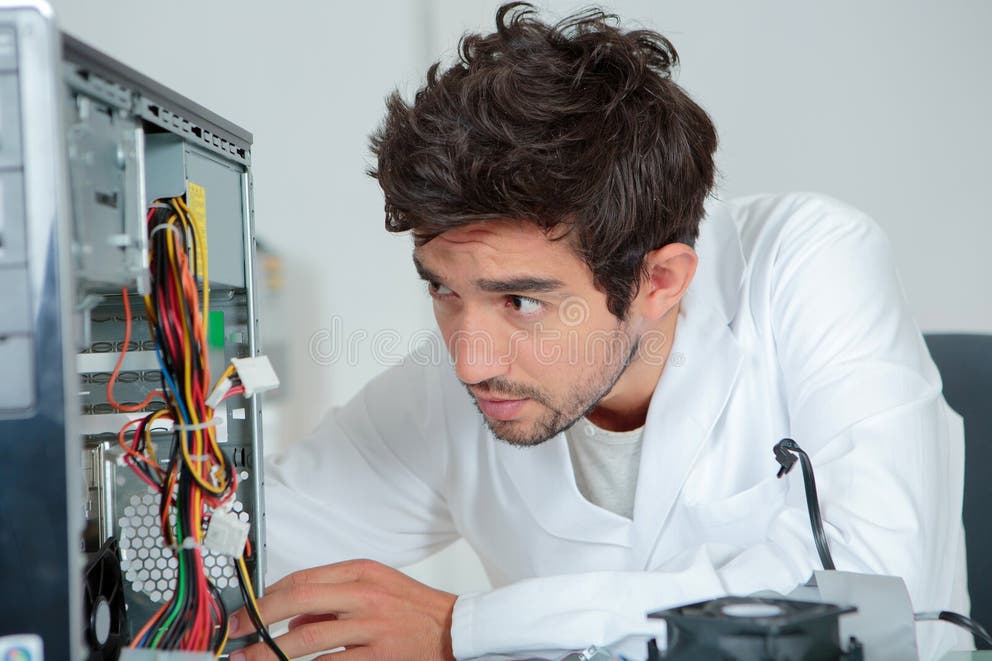 Computer Repairman Looking Confused Stock Photo - Image of tool ...
