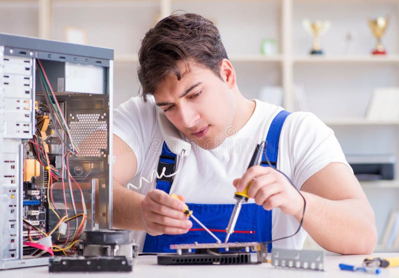 The Computer Repairman Working on Repairing Computer in it Workshop ...