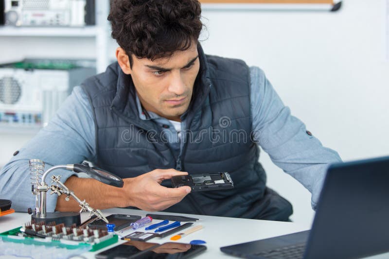 Computer Repairman Using Laptop To Research Problem Stock Image - Image ...