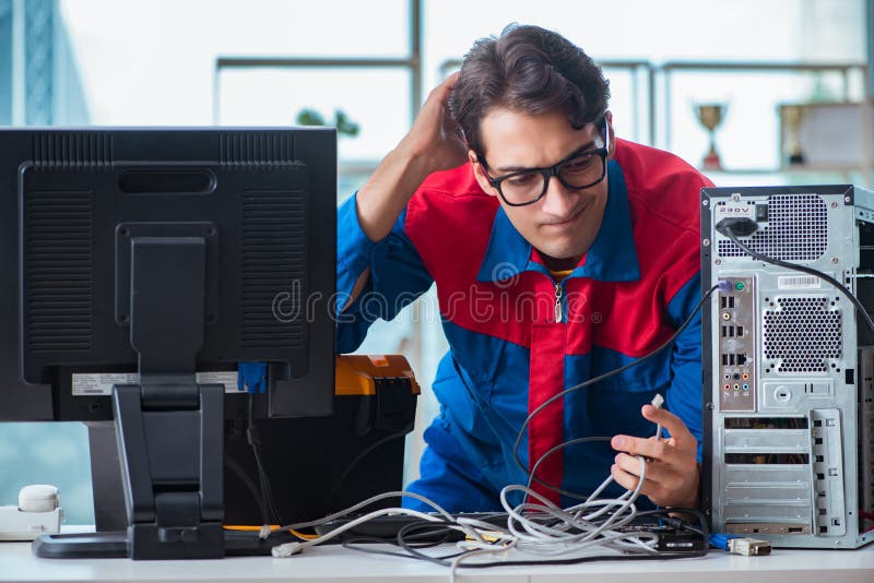 The Computer Repairman Working on Repairing Computer in it Workshop ...
