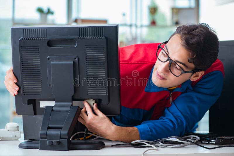 The Computer Repairman Working on Repairing Computer in it Workshop ...