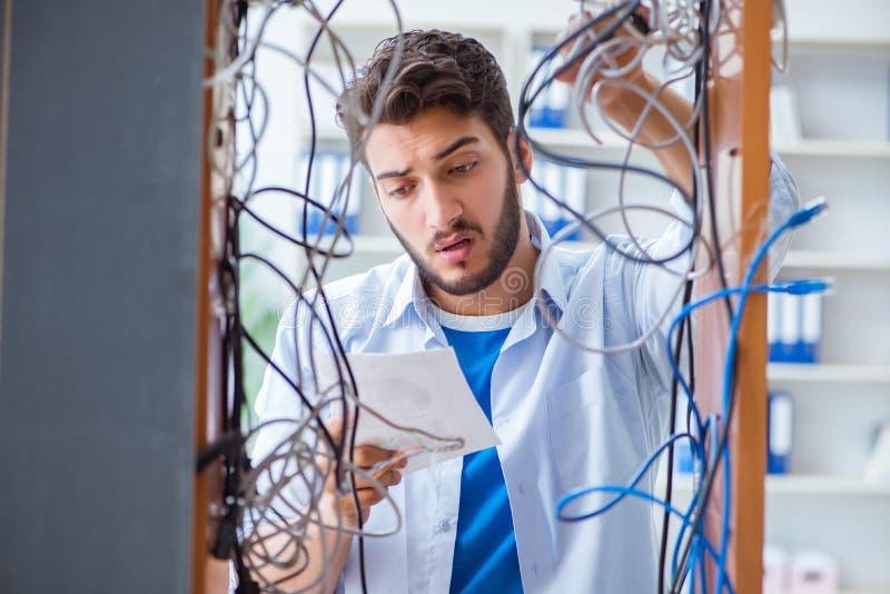 The Computer Repairman Working on Repairing Network in it Workshop ...