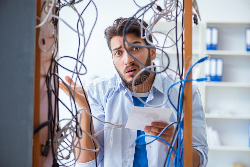 The Computer Repairman Working on Repairing Network in it Workshop ...