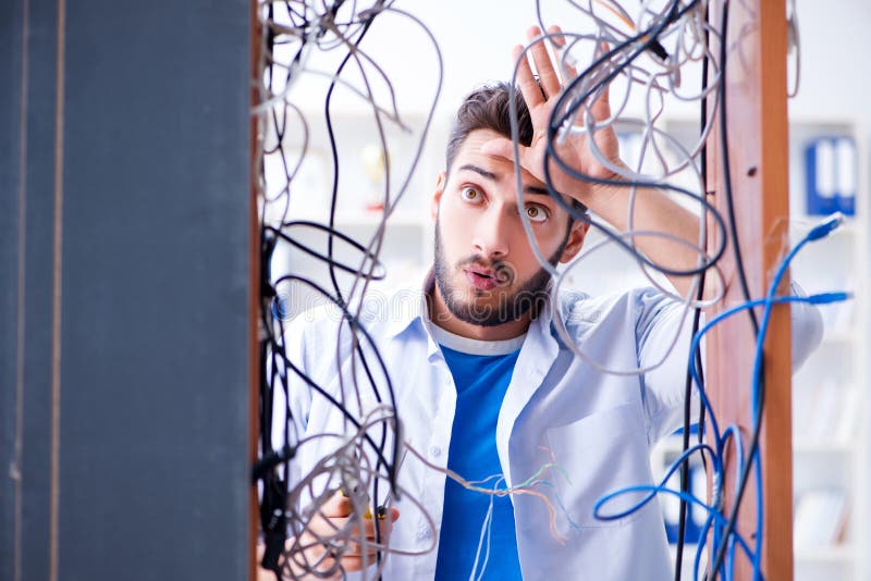 The Computer Repairman Working on Repairing Network in it Workshop ...