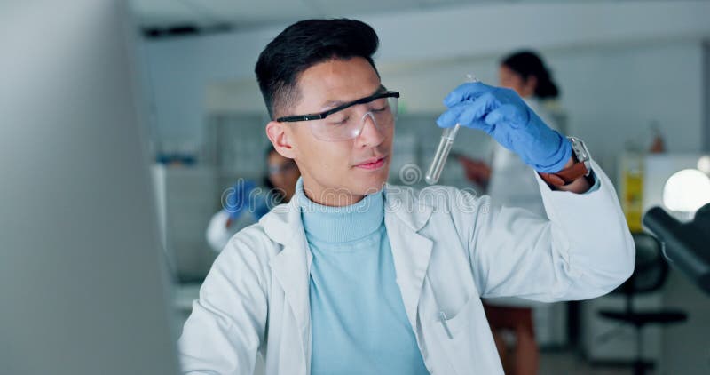 Computer, Results and Scientist with Sample in a Laboratory for ...