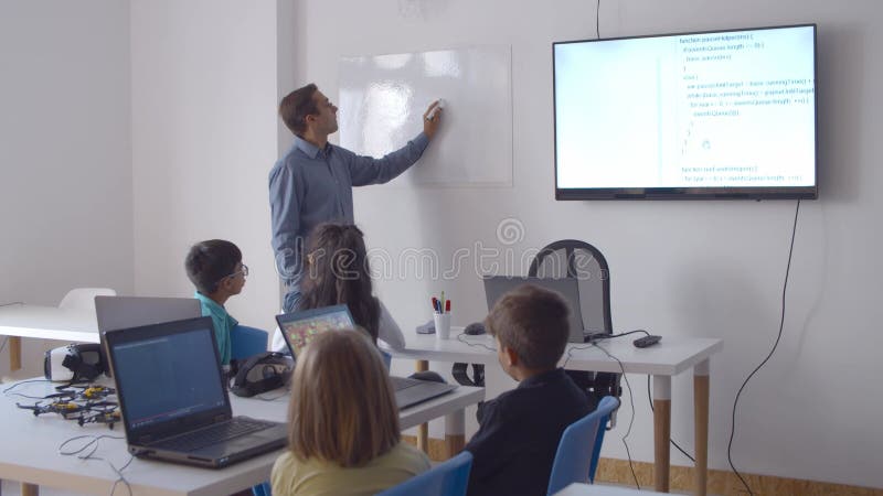 Computer Science Teacher Writing on Whiteboard Stock Footage - Video of ...