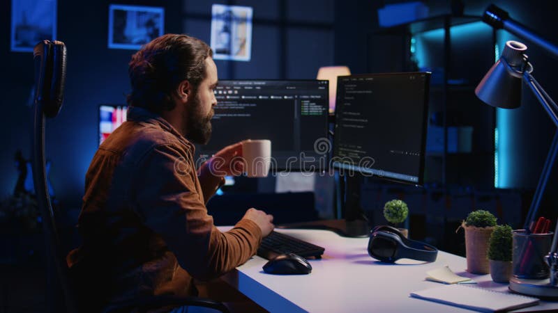 Computer Scientist Drinking Cup of Coffee while Developing Code on PC Stock Video - Video of ...