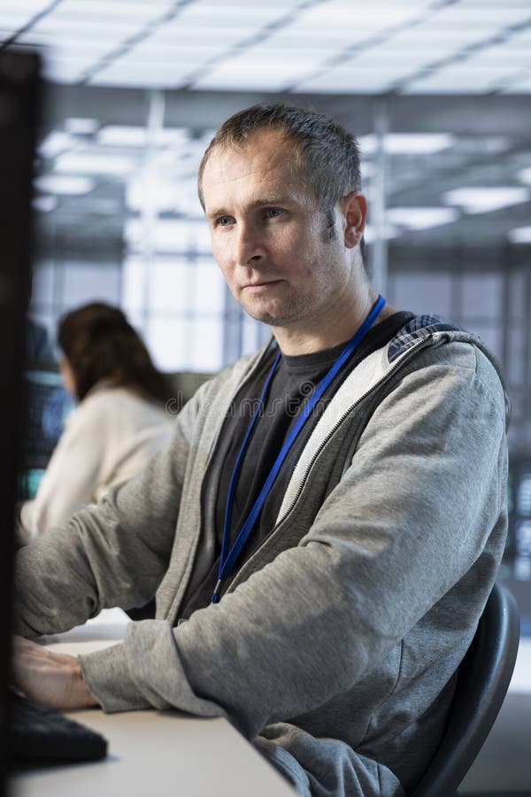 Computer Scientist in Server Farm Ensuring Compliance with Industry ...