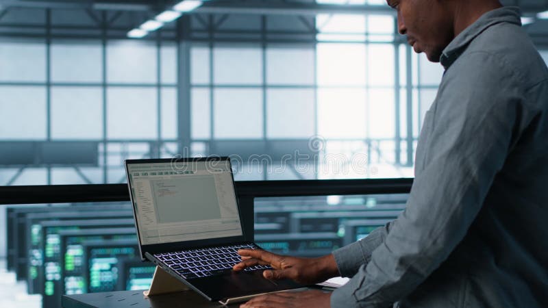 Man Coding On Data Center Testing Failover Scenarios Using Notebook Stock Footage Video Of
