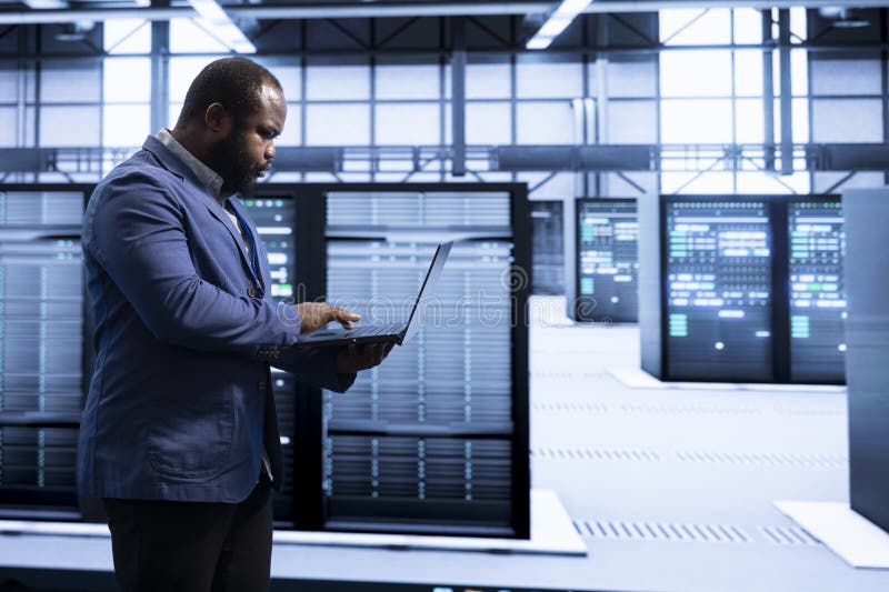 Computer Scientist Walking in Data Center, Using Laptop Stock Photo - Image of worker ...