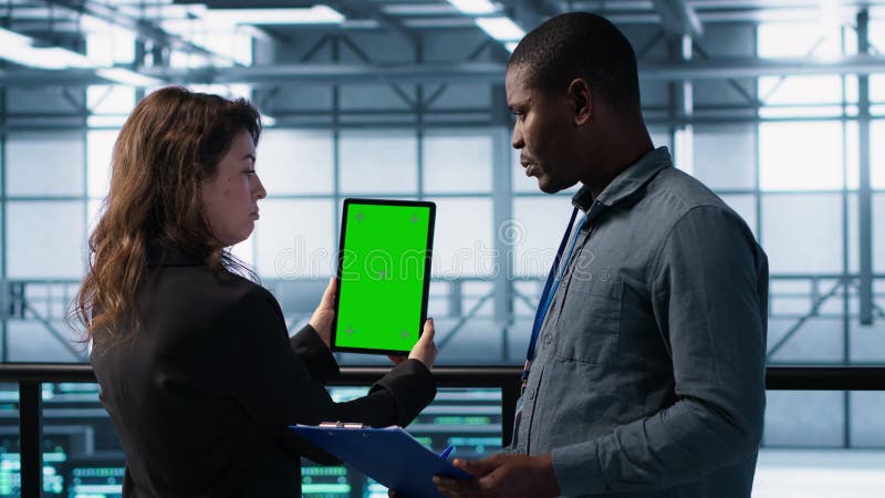 Computer Scientists in Data Center Use Mockup Tablet, Inspecting Server Rigs Stock Footage ...