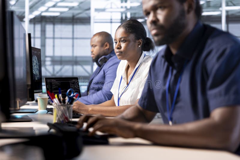 Computer Scientists Working in Server Hub, Maintaining Databases Stock ...
