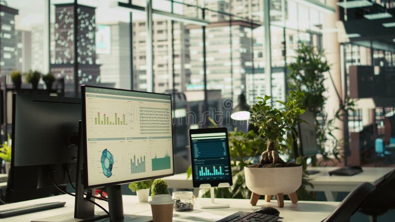 Computer Screen on Office Desk Displaying Financial Charts Stock Video ...