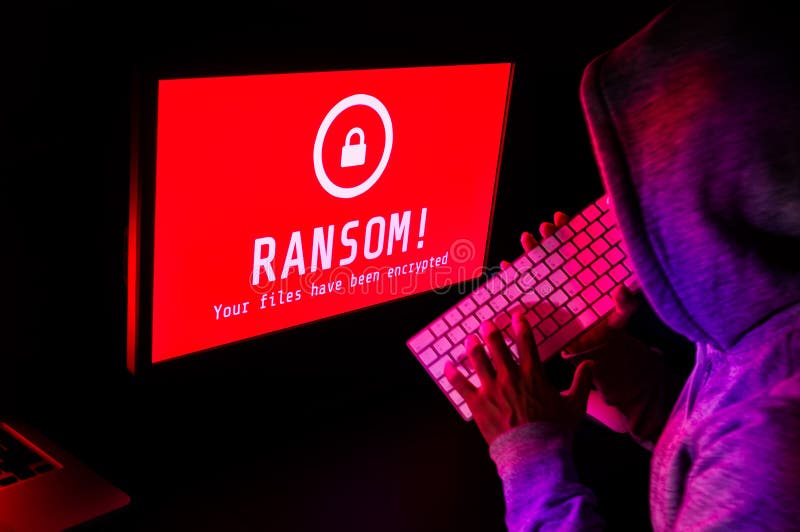 Computer Screen with Ransomware Attack Alert in Red and a Hacker Stock ... Computer Screen with Ransomware Attack Alert in Red and a Hacker Stock ...