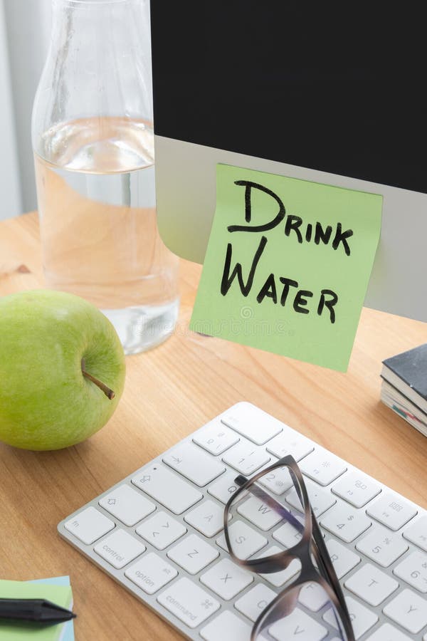 Computer Screen with Sticky Note Saying "Drink Water" As a Hydration Reminder Stock Photo ...
