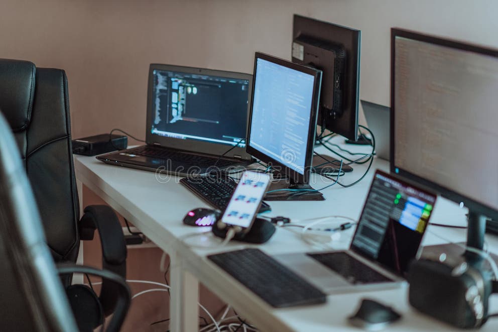 Computer Screens Running Programming Code in Empty Software Developing Agency Office and ...