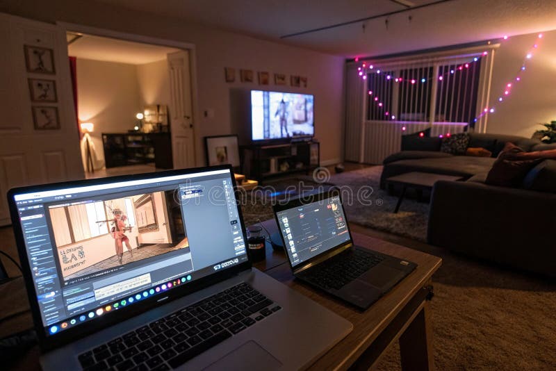 Computer Screens Showing Abstract Animation in Cozy Apartment Stock ...