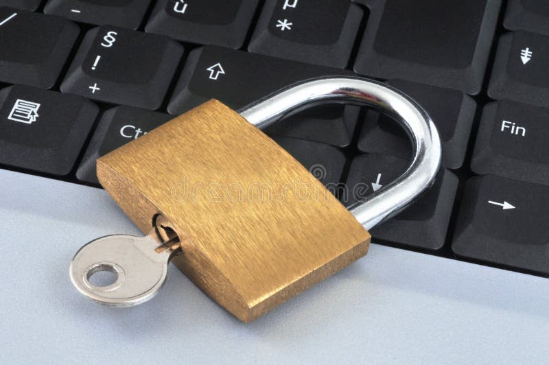 Computer Security Concept with a Padlock on a Laptop Computer Keyboard ...