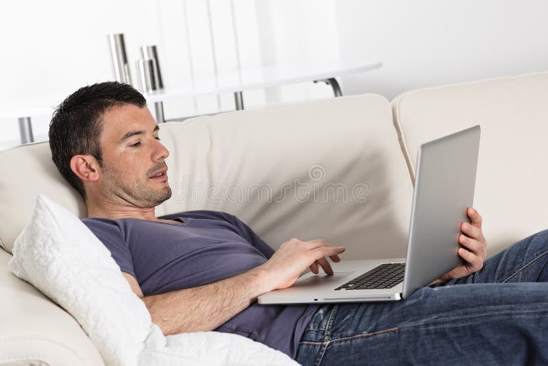 Computer on sofa stock photo. Image of portrait, attractive - 19590586
