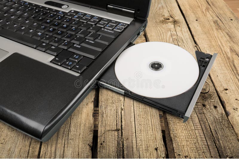 Inserting CD / DVD in Laptop Drive Stock Image - Image of optical ...