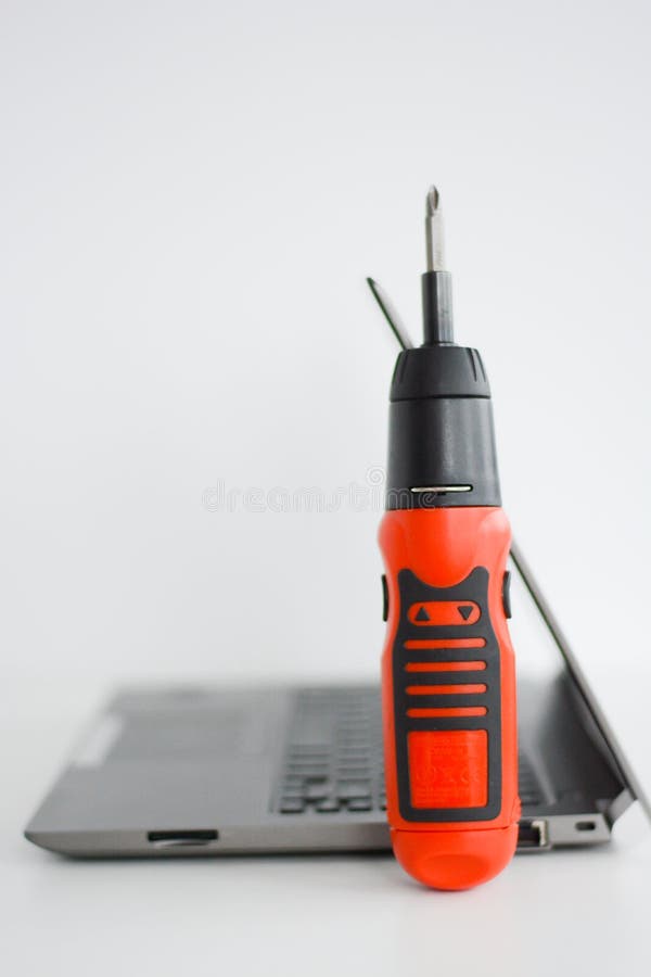 Computer Support with a Notebook and Screwdriver Stock Image - Image of ...