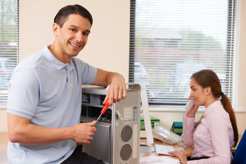 Computer it Support Worker Fixing Machine in Office Stock Photo - Image ...