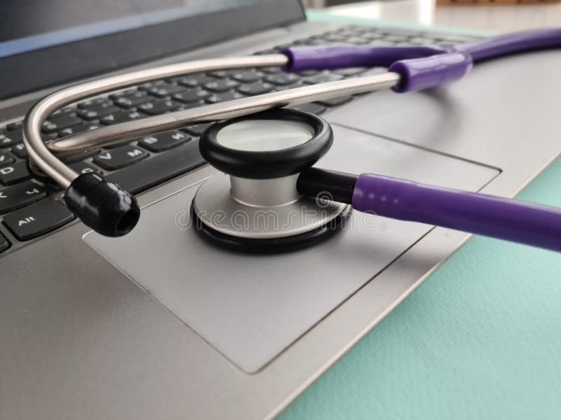 Computer System Status or Audit and Stethoscope Over Computer Keyboard ...