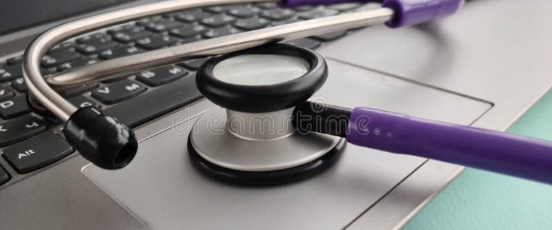 Computer System Status or Audit and Stethoscope Over Computer Keyboard ...