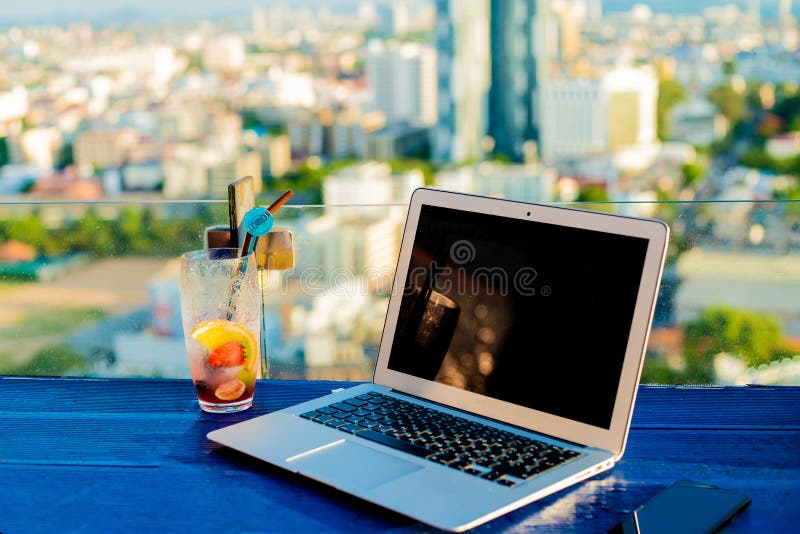 The Computer is on the Table Near the Panoramic Window with a Beautiful ...