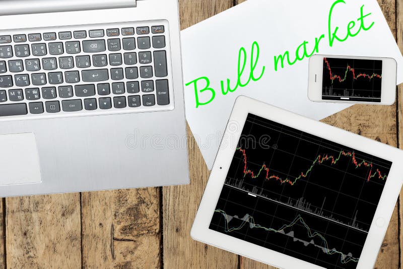 Computer, Tablet, Smartphone and Paper with Text Bull Market on Stock ...