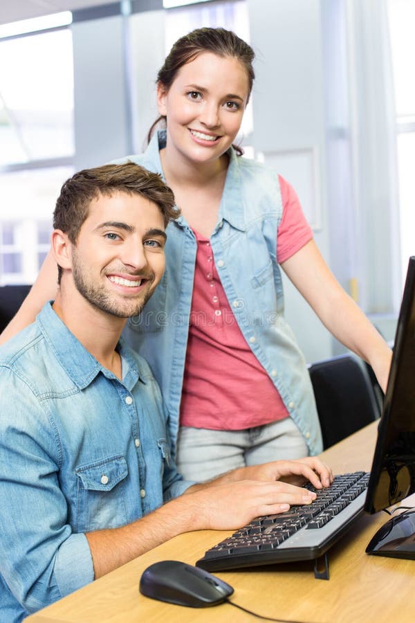Computer Teacher Assisting a Student Stock Image - Image of ...