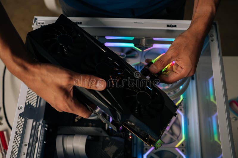 Computer Technician Installing New Graphics Card into Modern Custom-built Pc with RGB Lighting ...